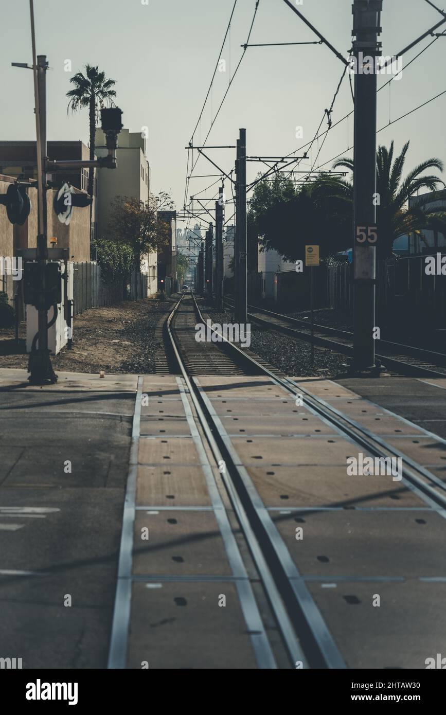 Railroad tracks going the through the street and onto downtown Stock ...
