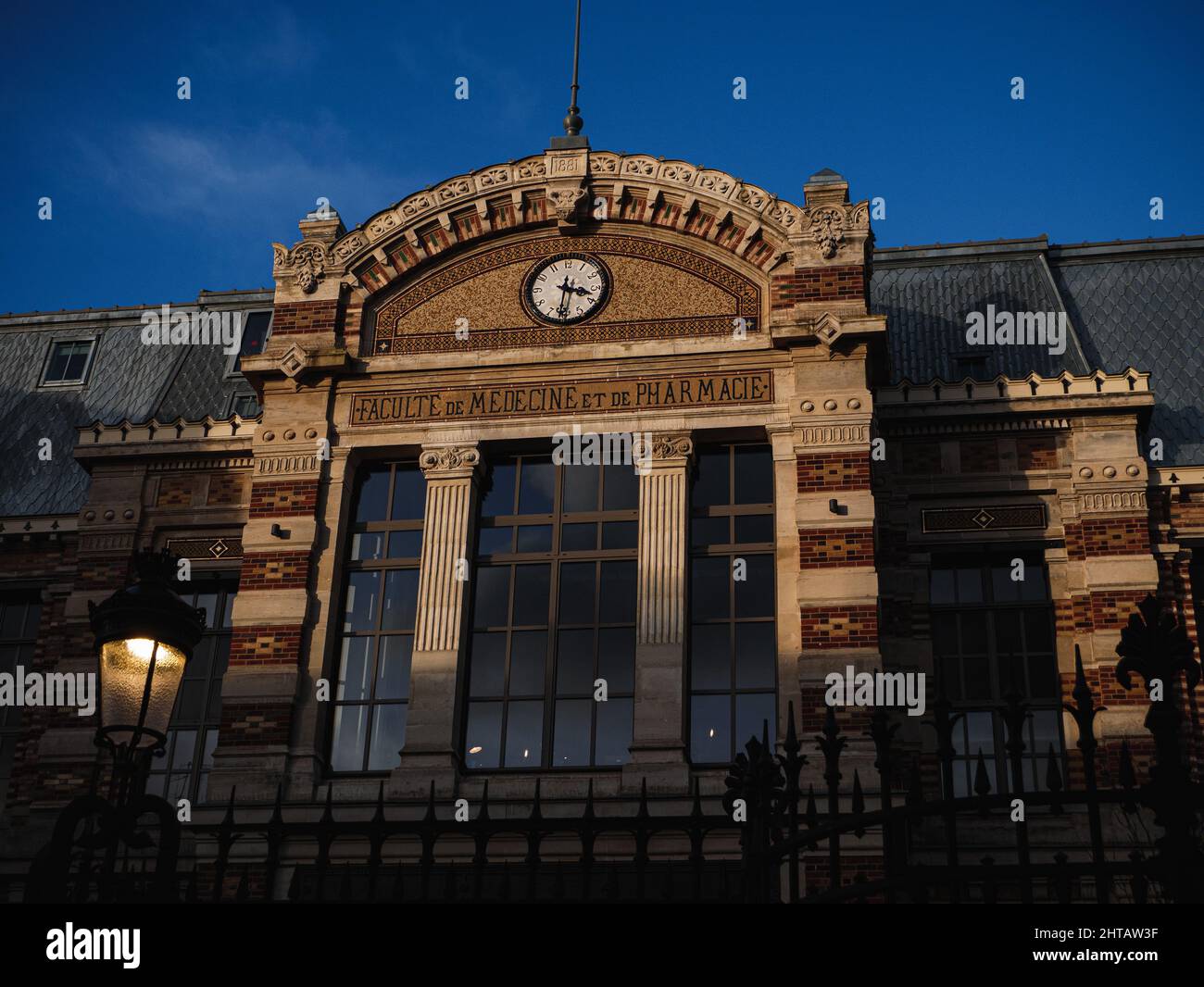 A scenic view of an antique university building exterior with brick ...