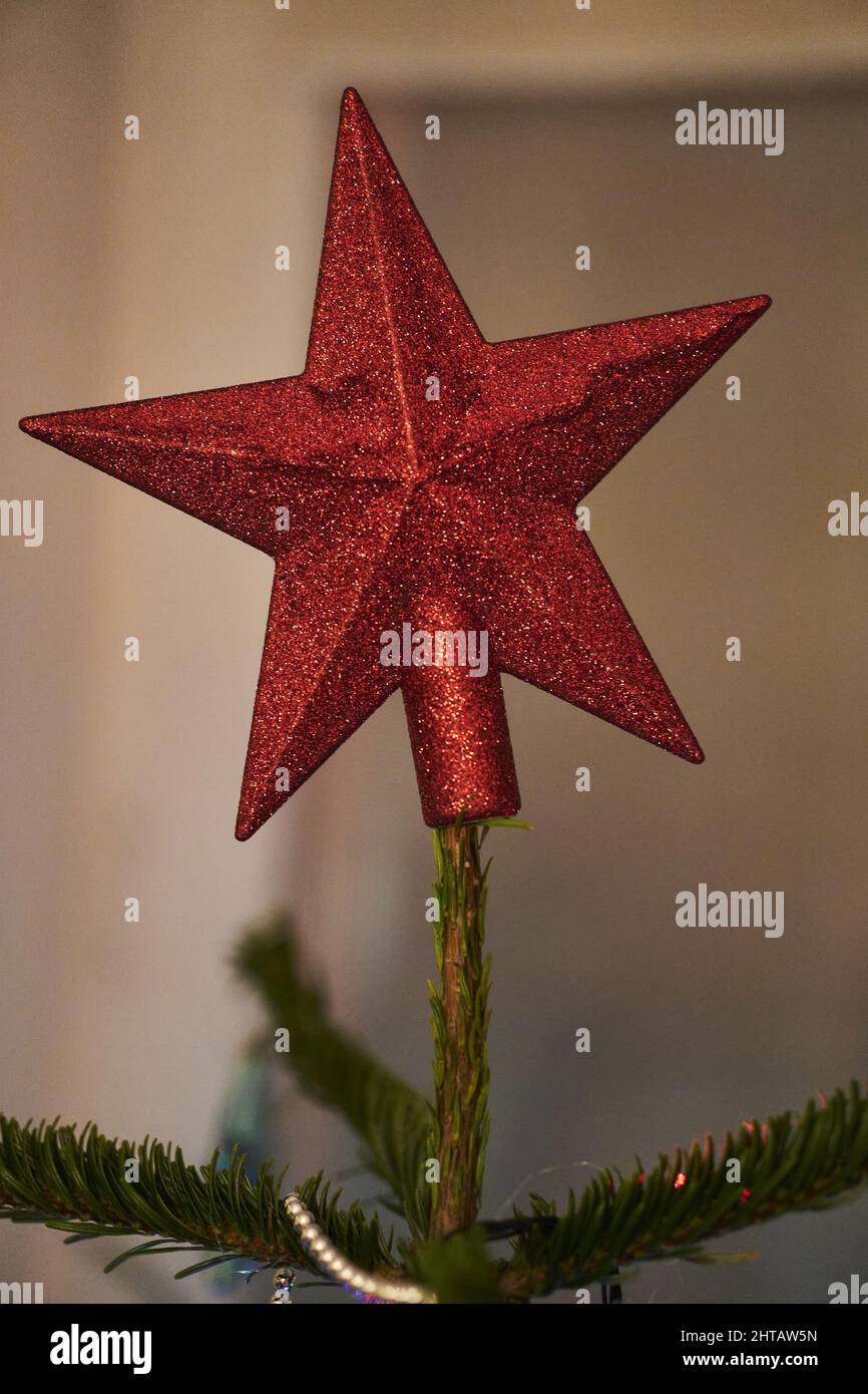 Closeup of a red star on a christmas tree Stock Photo - Alamy