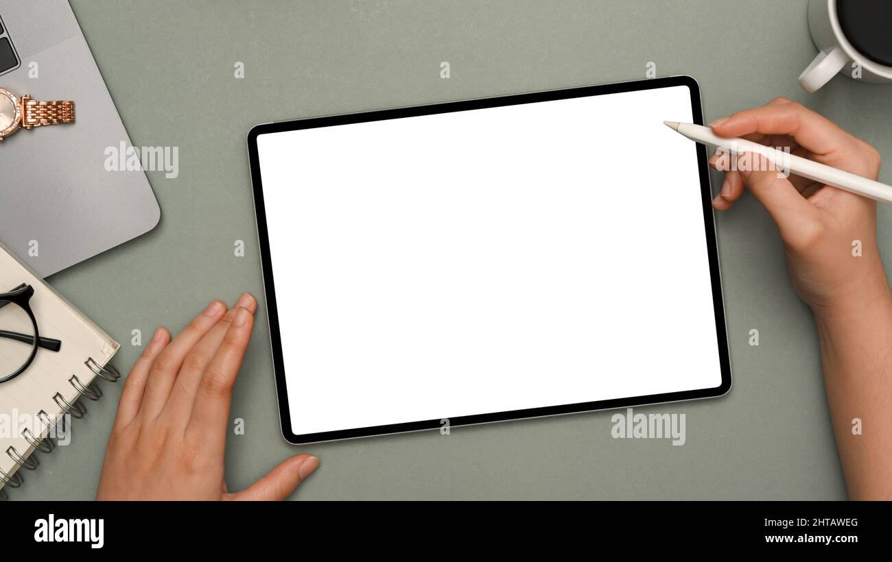 Close-up, top view, Female hand using stylus pen drawing on digital ...