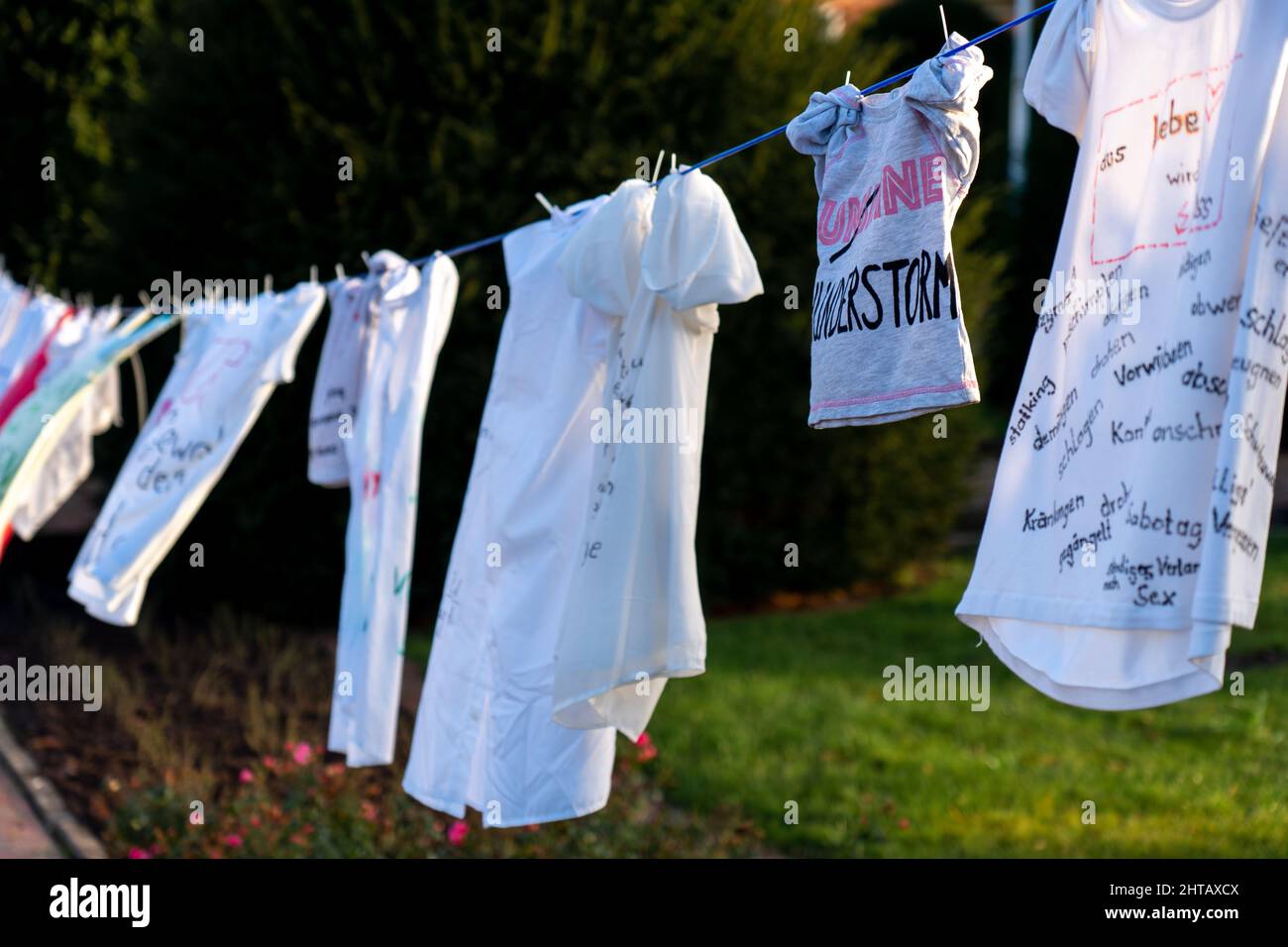 Shallow focus of White clothes hanging with written messages Stock ...