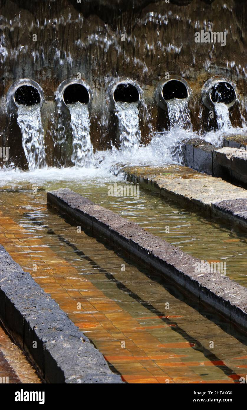 Vertical shot of the water flowing through the wastewater pipes to the ...