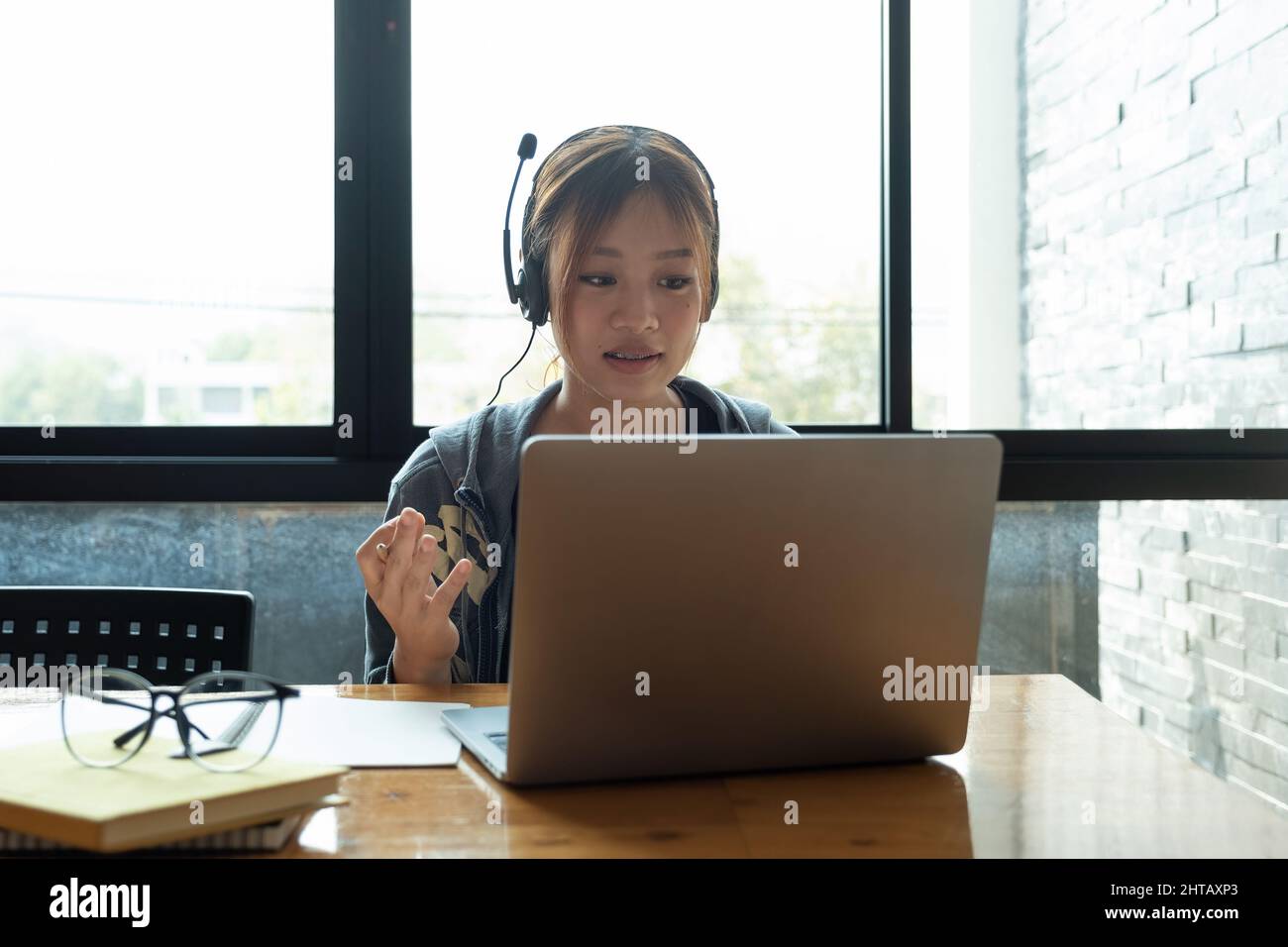 Female student study in the cafe coffee shop. She using laptop and ...
