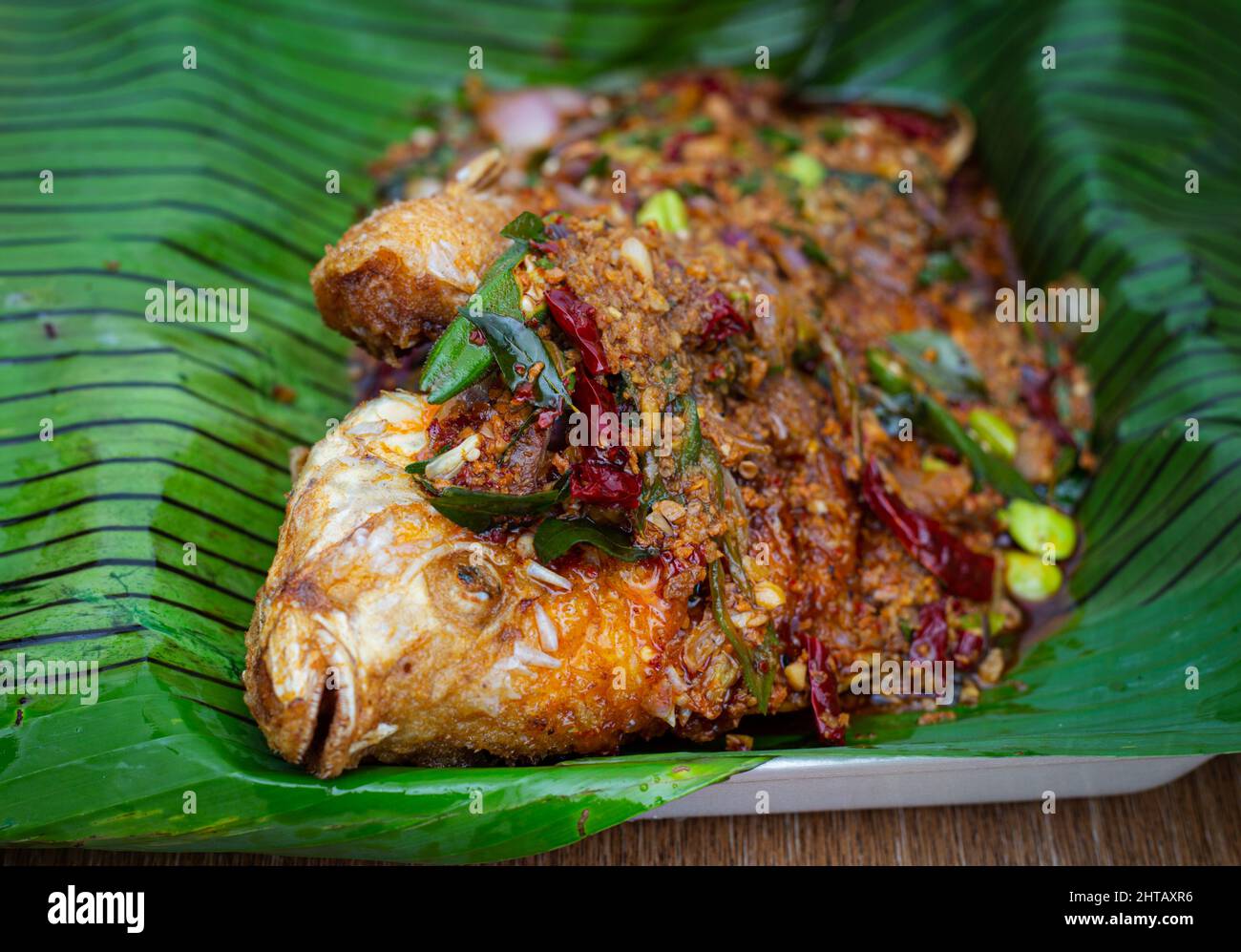 Top view of sizzling fish dish Stock Photo - Alamy