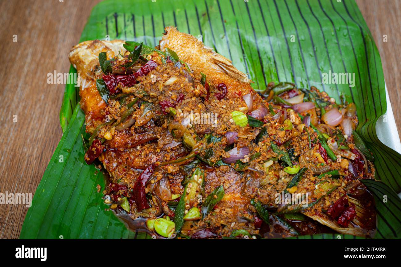 Top view of sizzling fish dish Stock Photo - Alamy