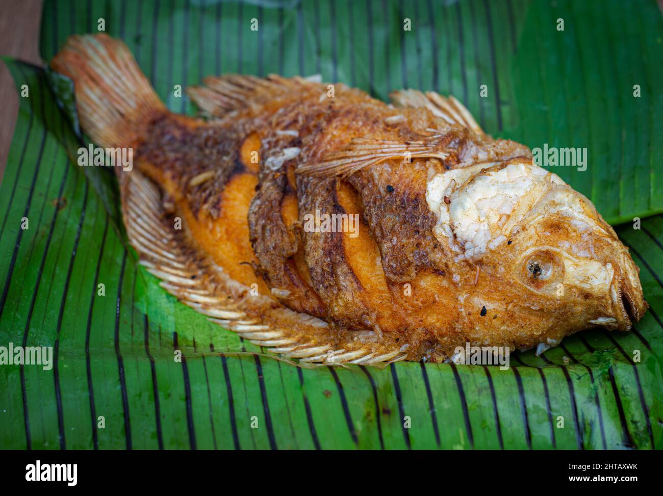 Top view of sizzling fish dish Stock Photo - Alamy