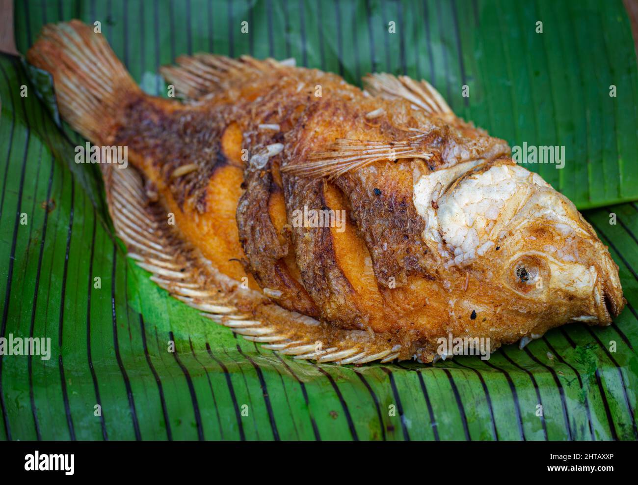 Top view of sizzling fish dish Stock Photo - Alamy
