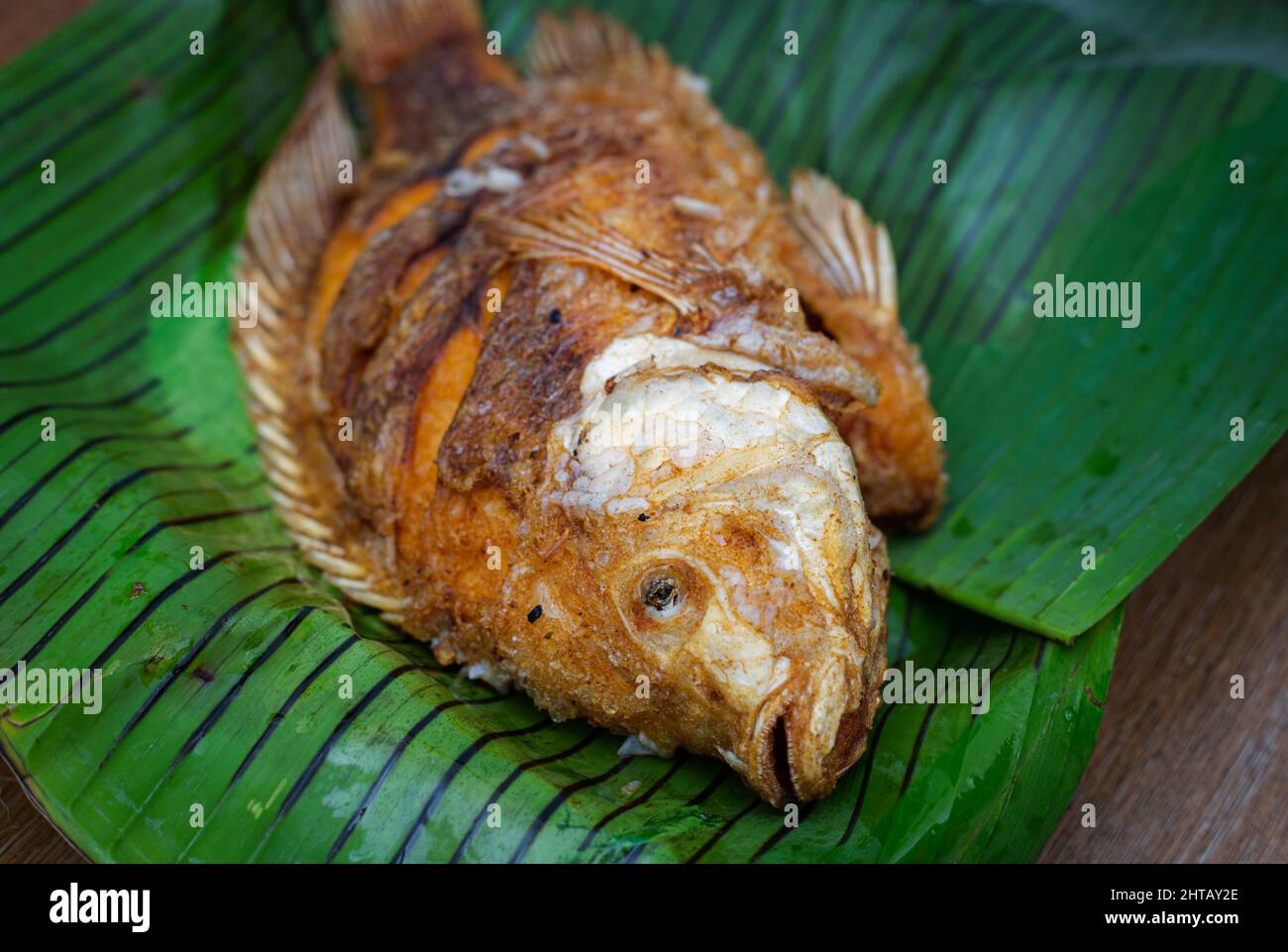 Top view of sizzling fish dish Stock Photo - Alamy