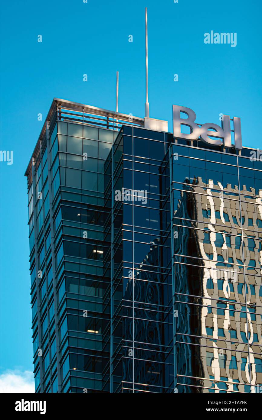 Vertical shot of the Bell office building with a light blue sky on the ...