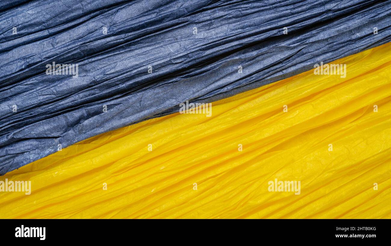 paper abstract in colors of Ukrainian national flag - blue and yellow ...