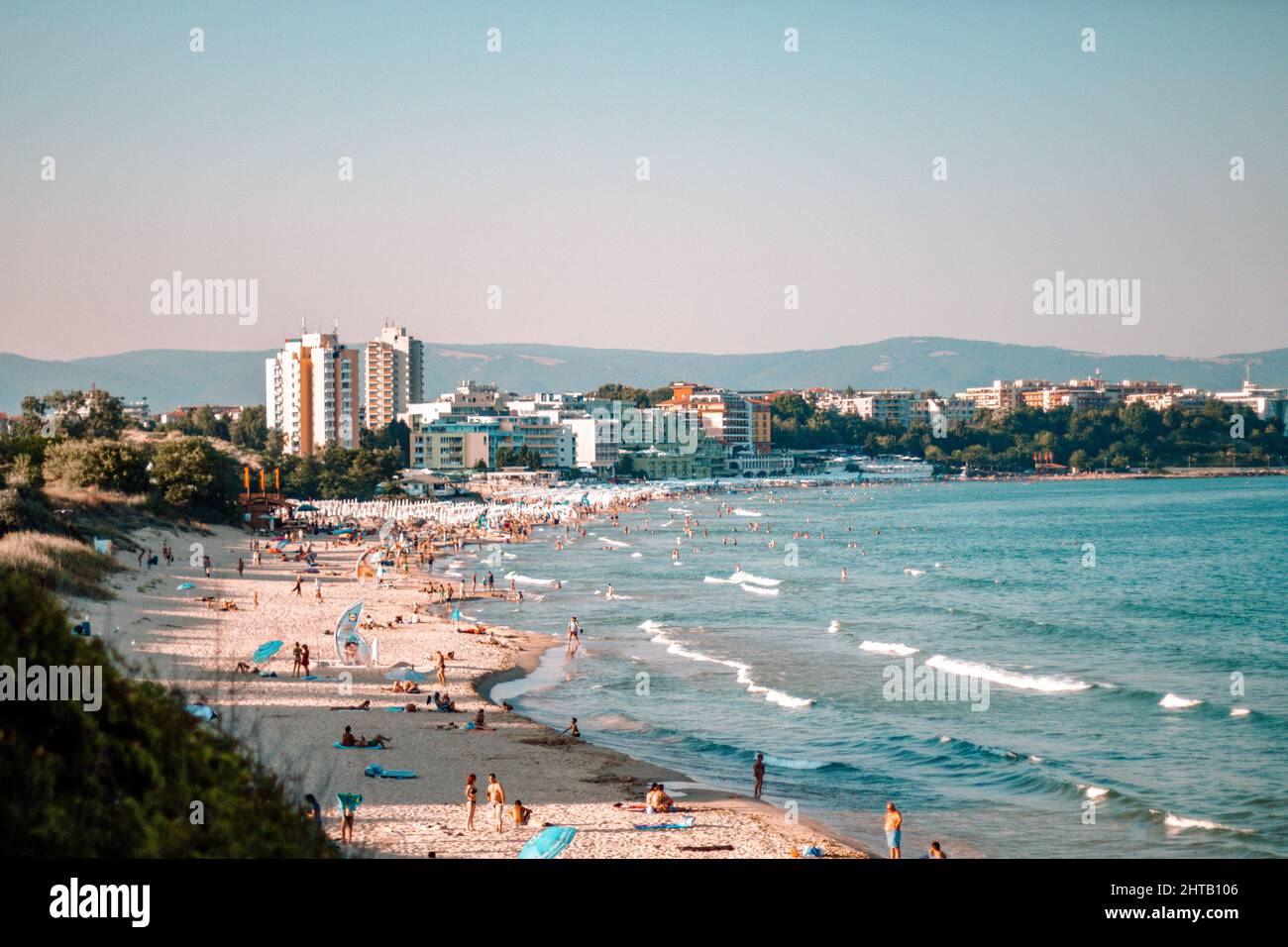 Beautiful long seaside shore blue seawater with island with houses on ...