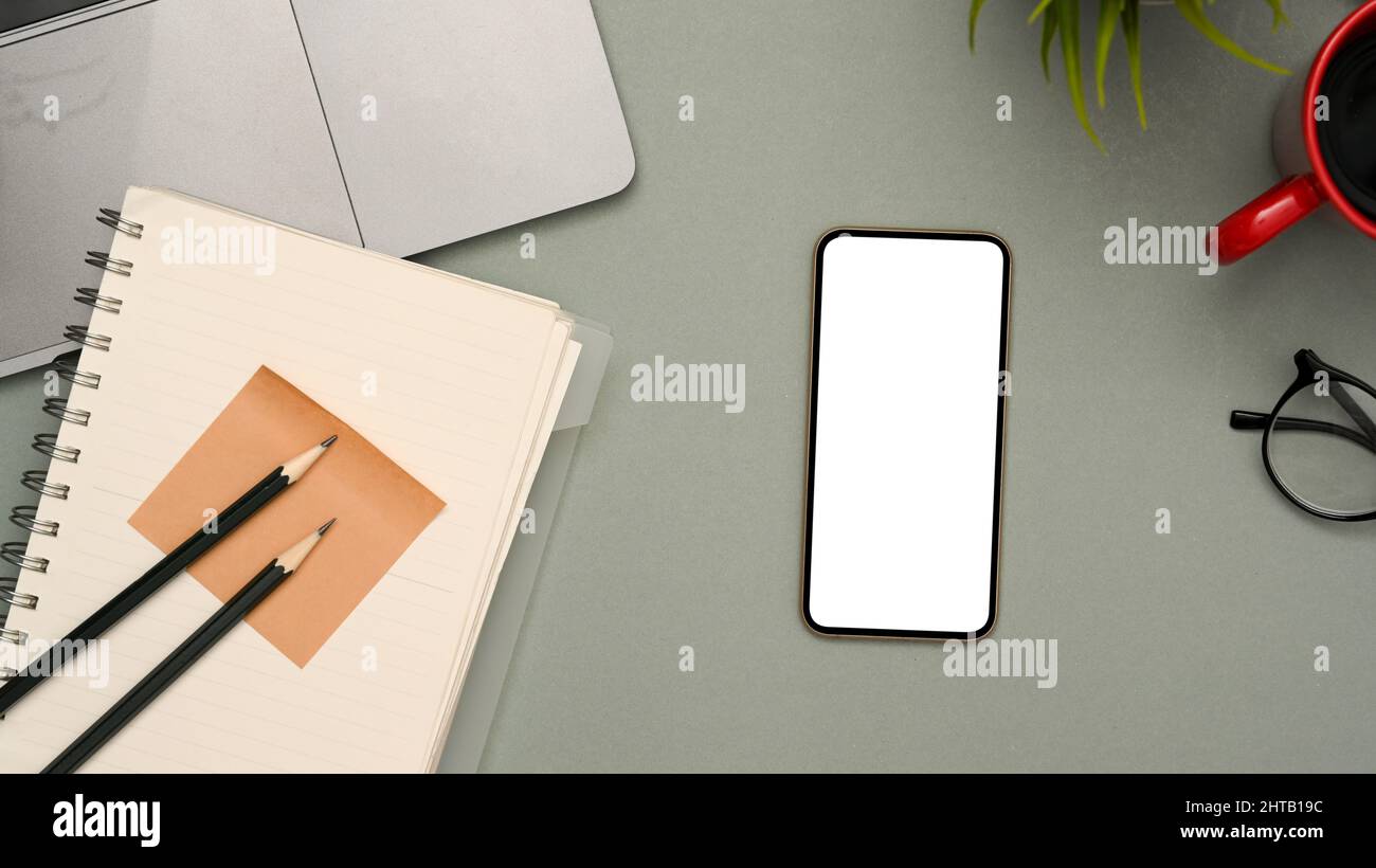 Modern business office desk with spiral notepad, pencil, glasses ...