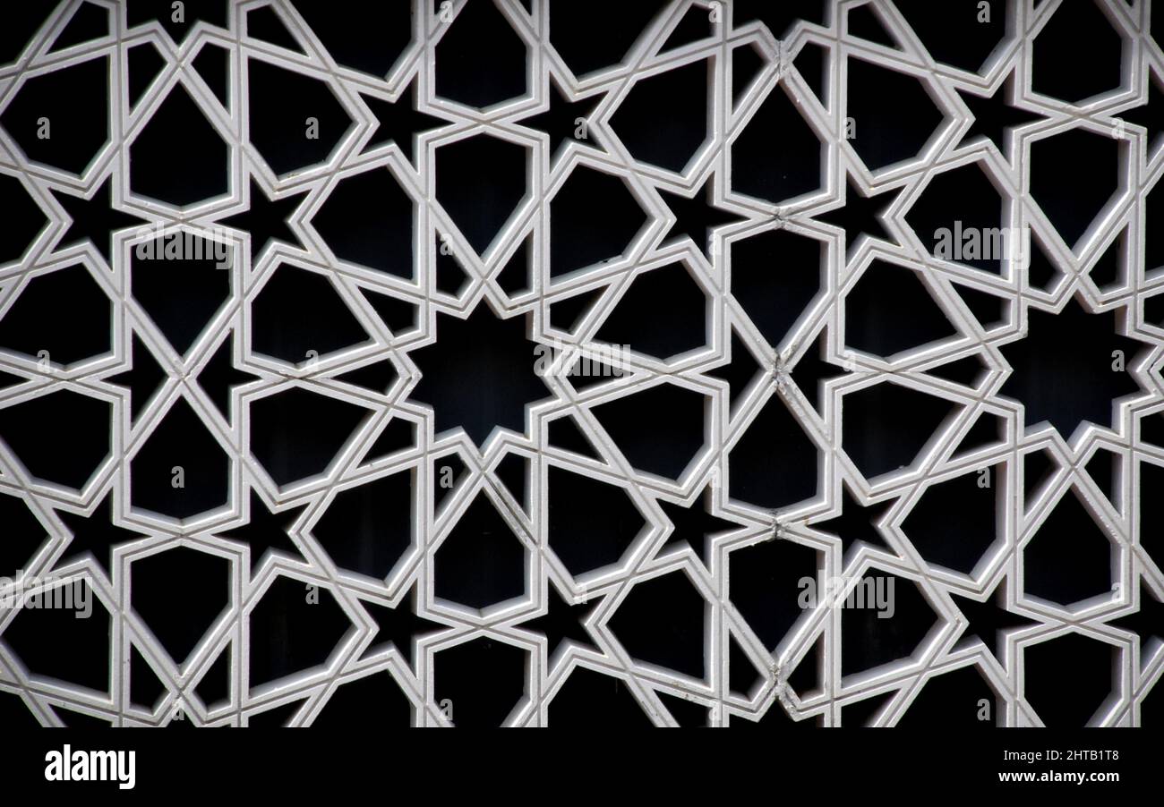 Pattern on the walls of a mosque isolated on the black background in ...
