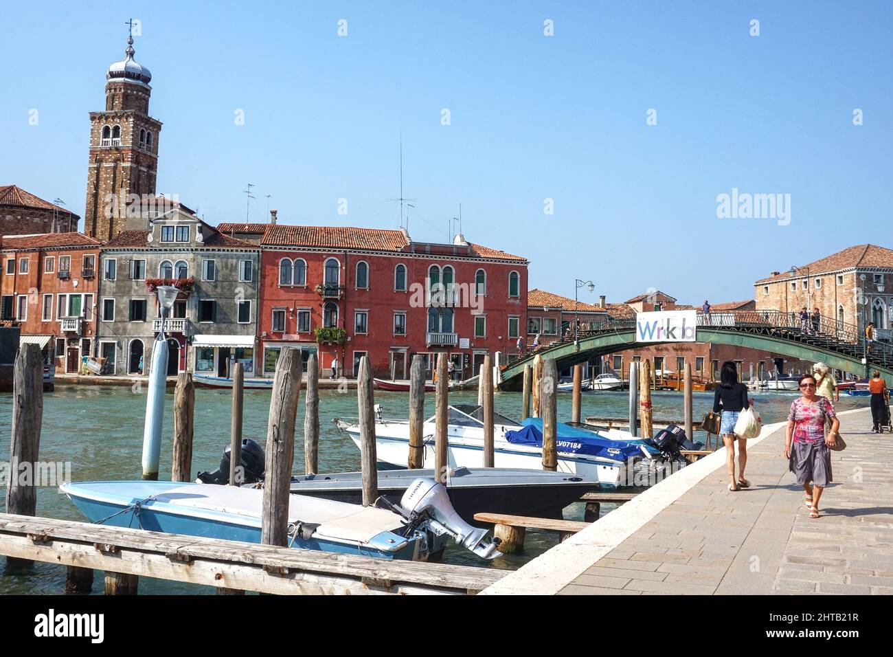 Beautiful view on the canal with boat and motorboat in the water in ...