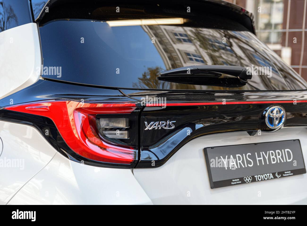 Rear end and tail lights of new white Toyota Yaris hybrid car Stock ...