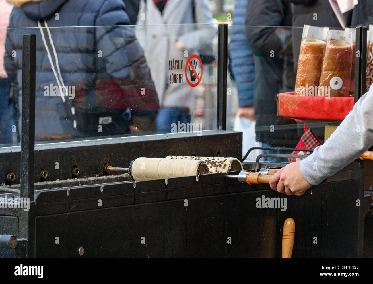 Person baking chimney cake hi-res stock photography and images - Alamy