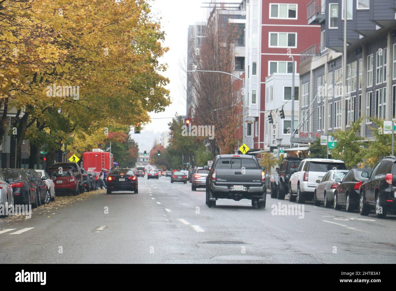 Shot of cars moving and parked in the street of Seattle, USA Stock ...