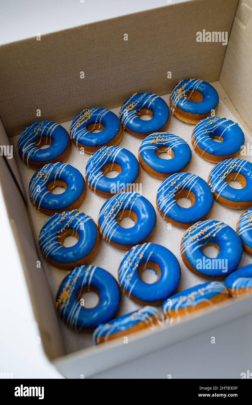 Photo of donuts with blue icing and edible golden pearls Stock Photo ...