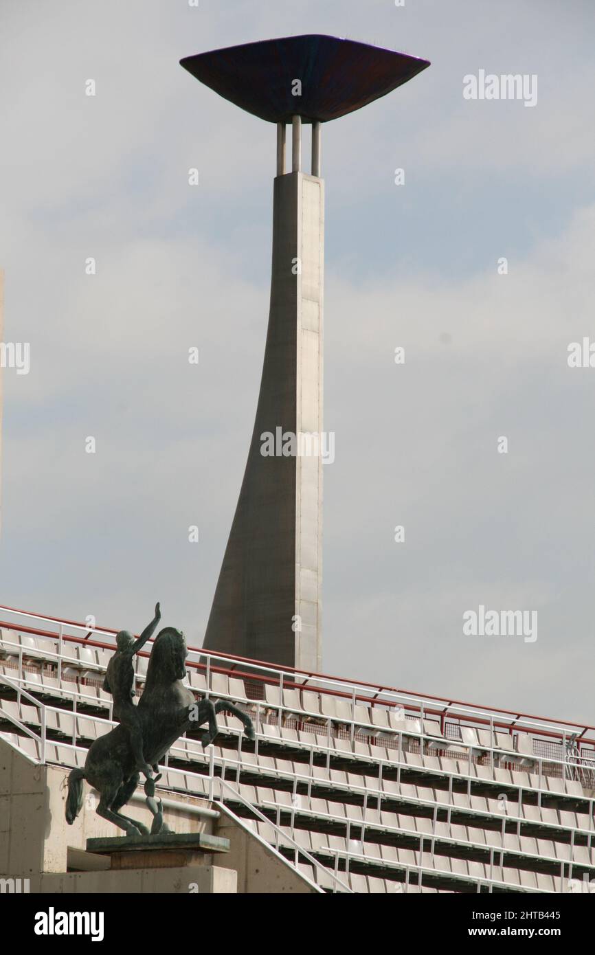 A tower with a small monument next to it Stock Photo - Alamy