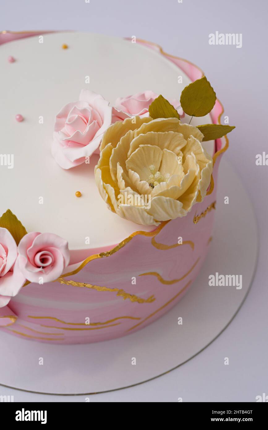 Vertical photo of floral cake design on a white background Stock Photo ...
