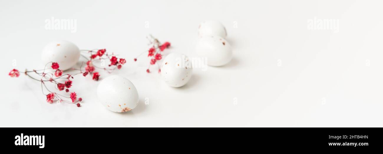 Easter minimal composition with eggs and flowers on the white ...