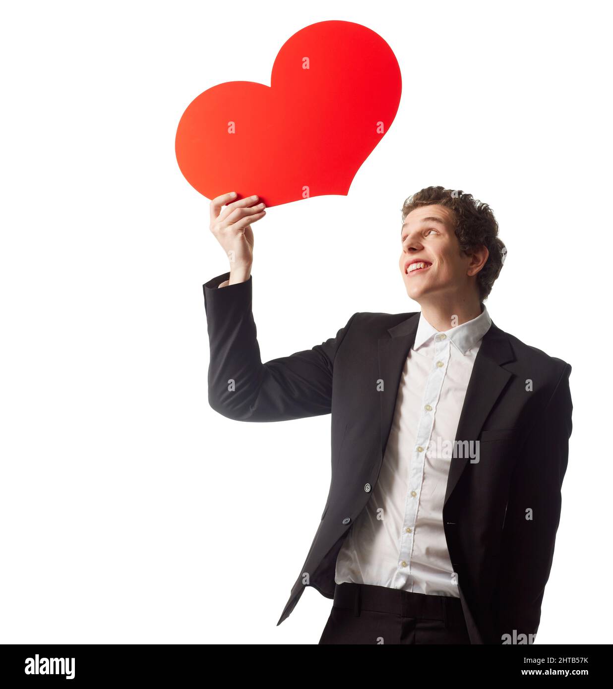 I have only one thing on my mind.... A young man holding a heart symbol ...