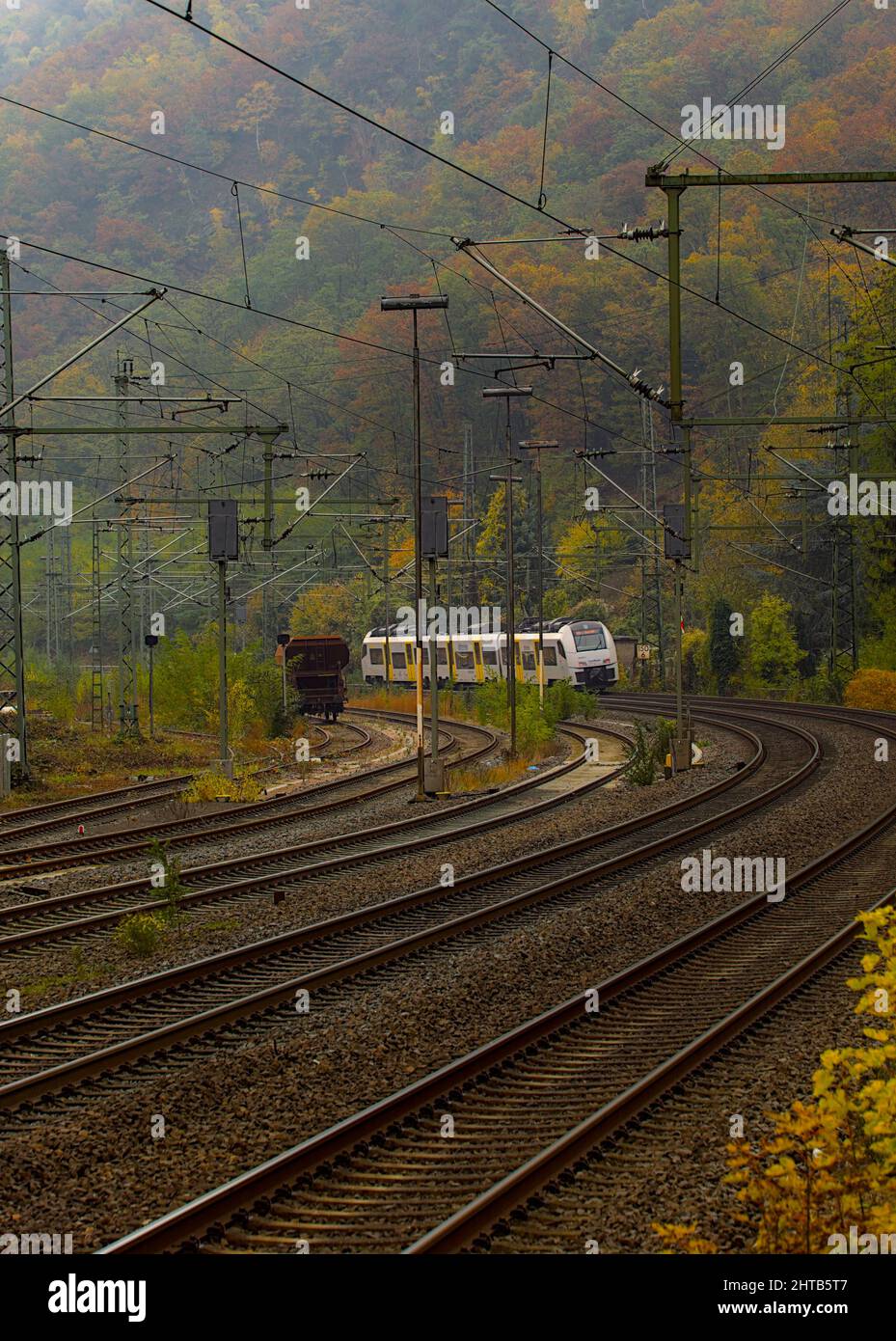 Vertical shot of a passenger train in the Upper Middle Rhine Valley ...
