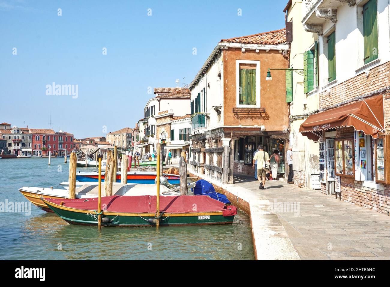 Beautiful view on the canal with boat and motorboat in the water in ...