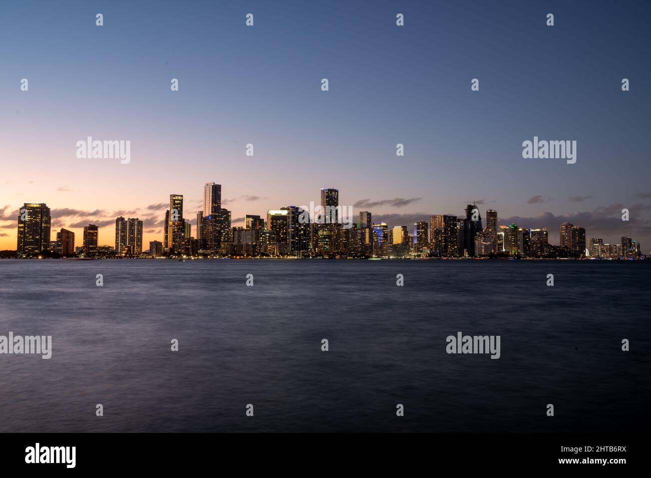 Cityscape of downtown Miami, blue hour with sunset. City lights and the ...
