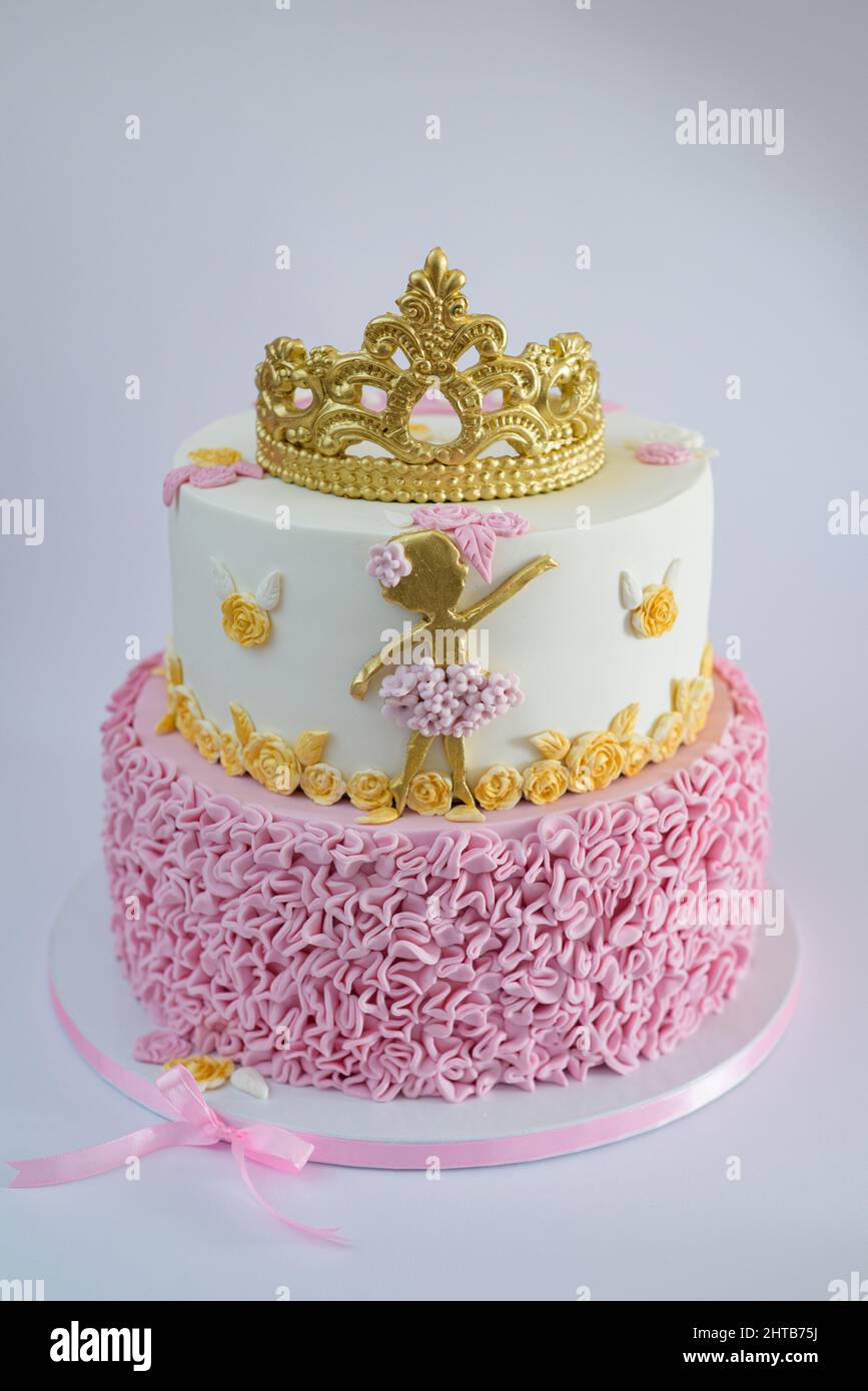 Vertical shot of a cute cake for the baby girl with a crown Stock Photo ...