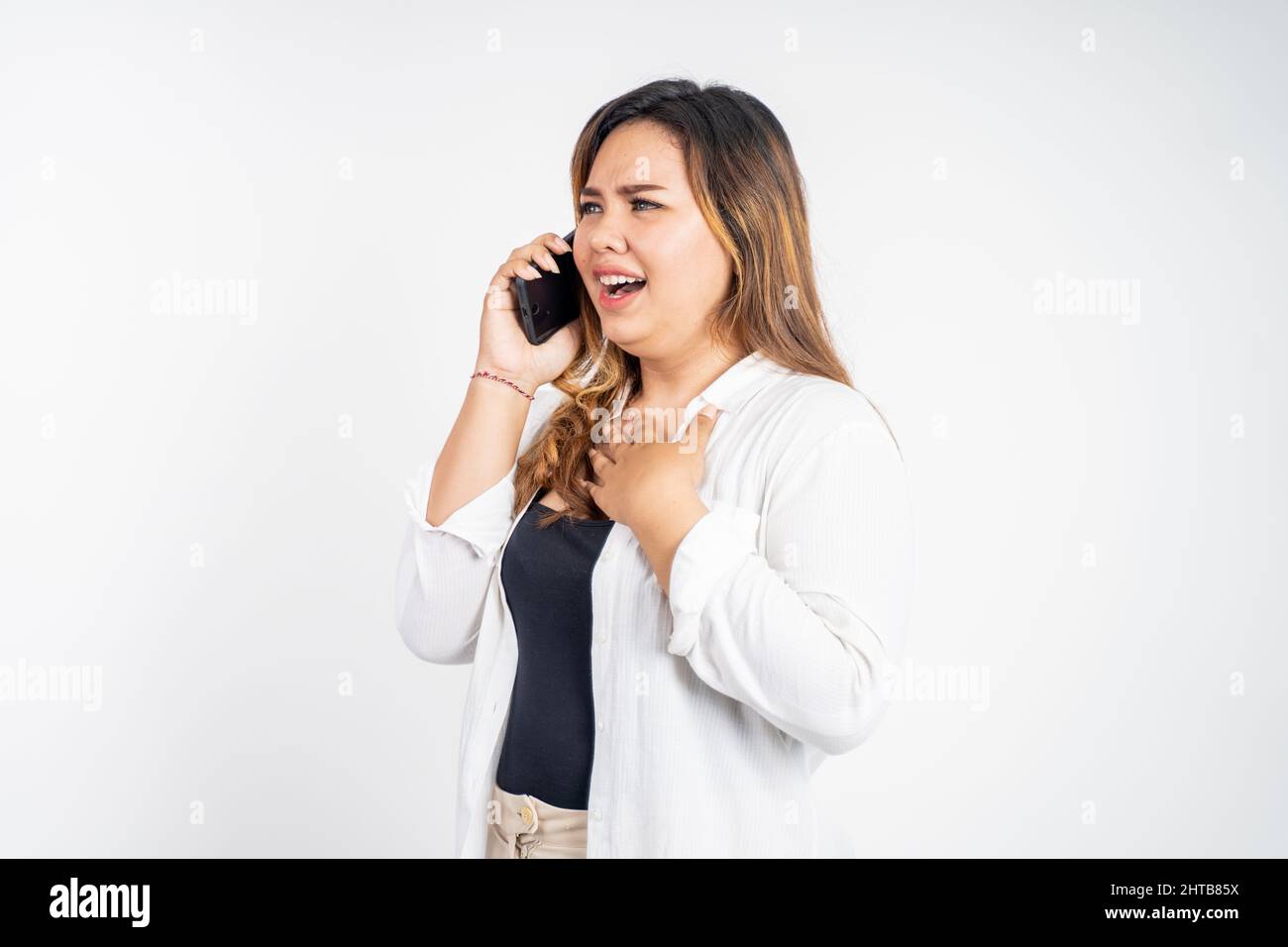 angry asian woman when making a phone call Stock Photo - Alamy