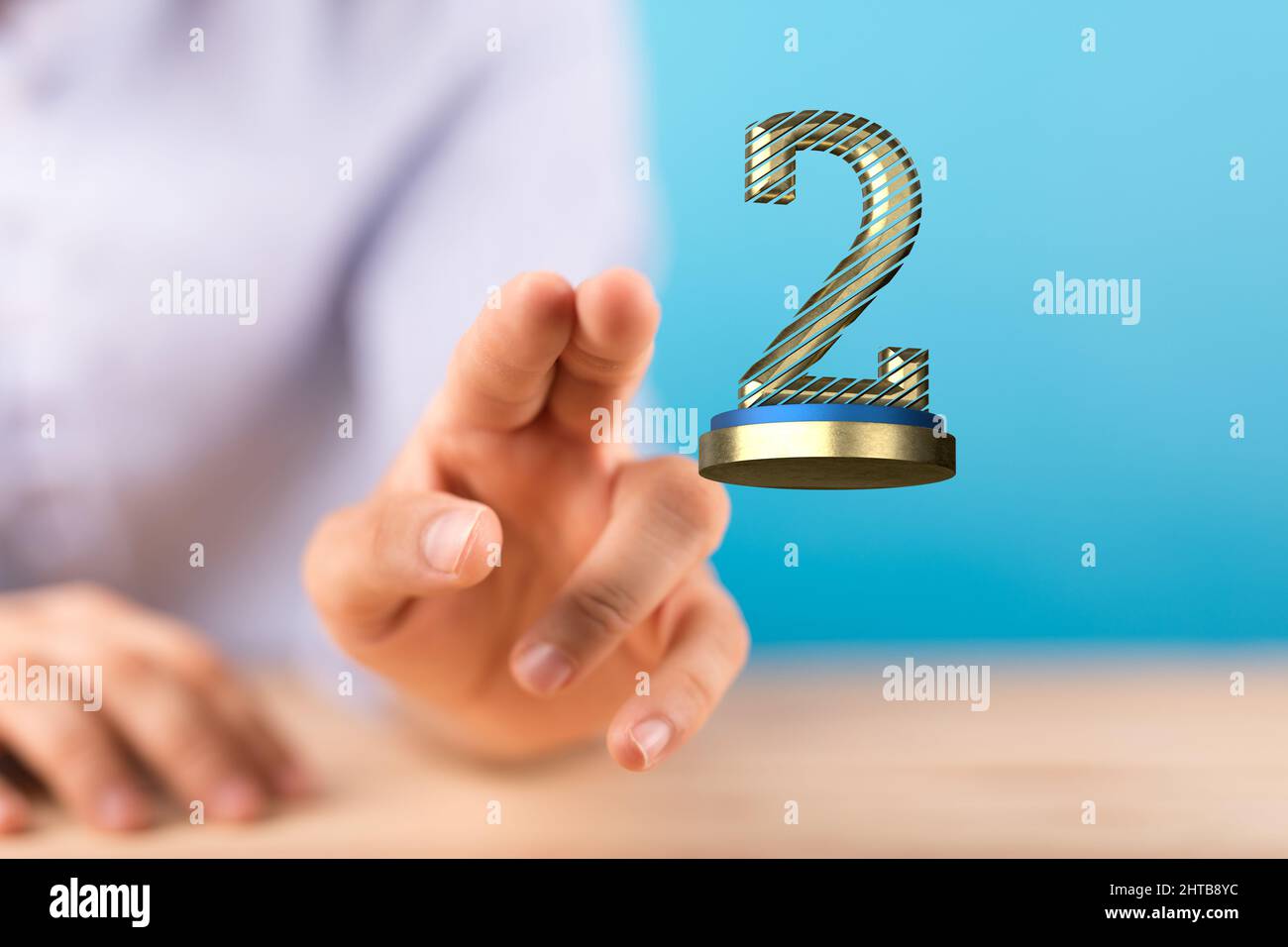 3D rendering of a floating gold 2nd place trophy with a person pointing ...