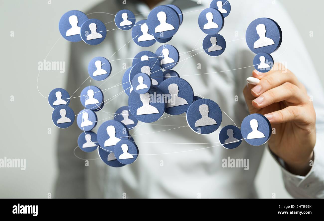 Person presenting a virtual projection of human network Stock Photo - Alamy