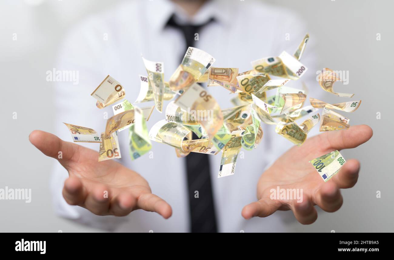 Banknotes floating in the air between the hands of a businessman Stock ...