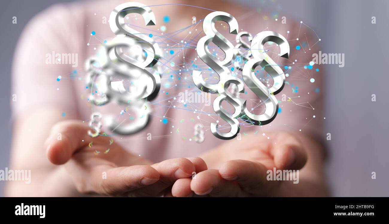 Shallow focus shot of a human hands holding law paragraph icons Stock ...