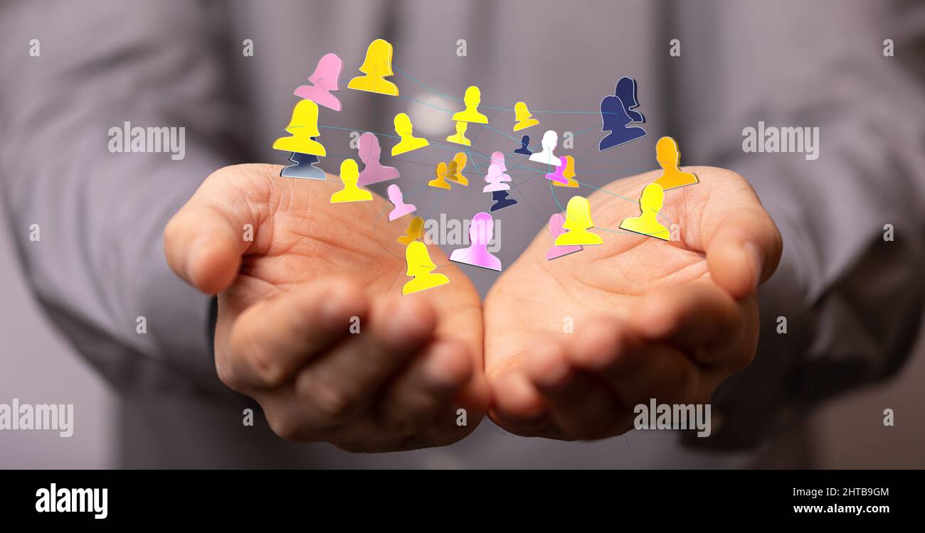 Shallow focus shot of human hands holding interconnected human icons ...