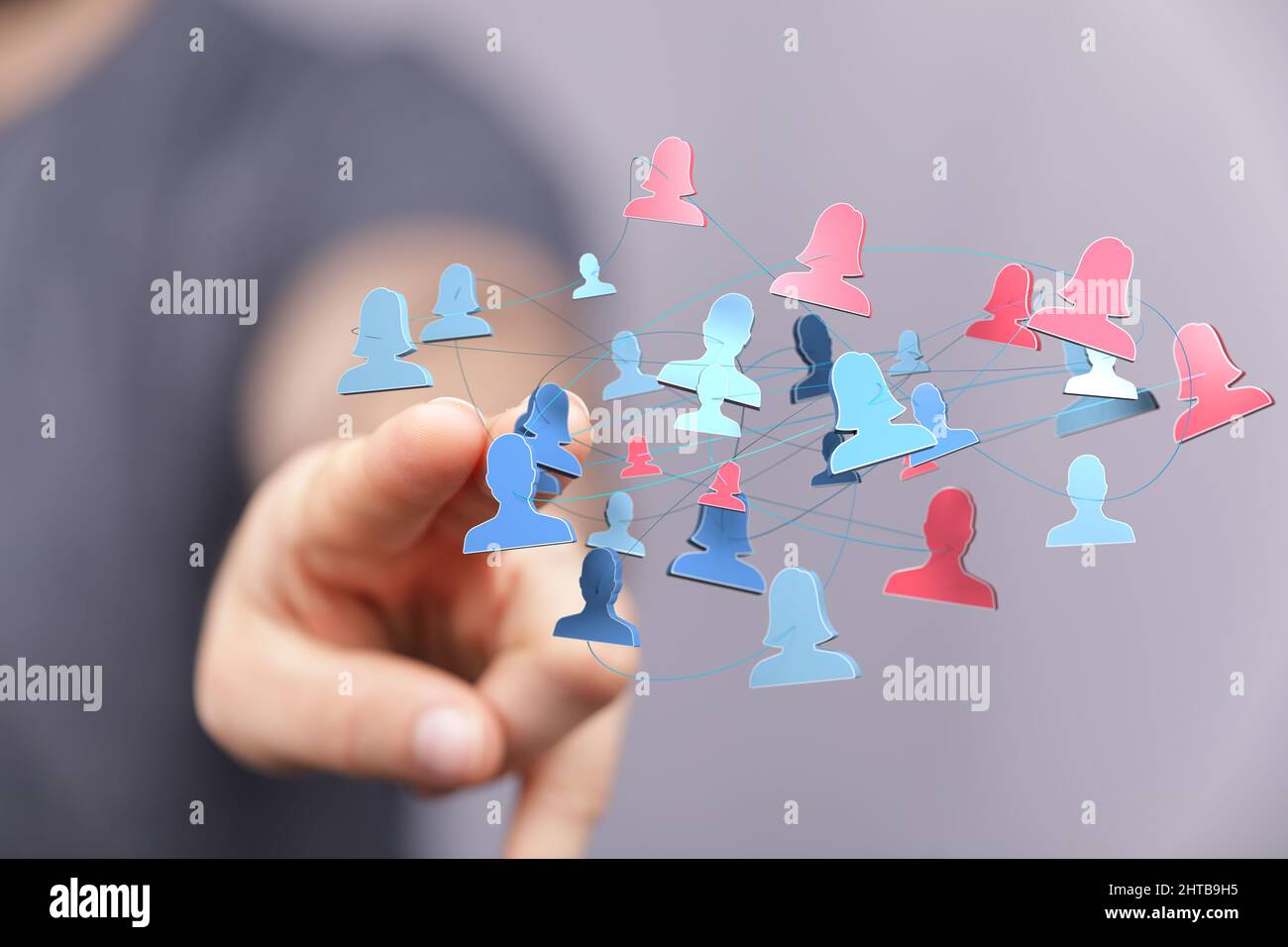 Shallow focus shot of a human hand pointing at interconnected human ...