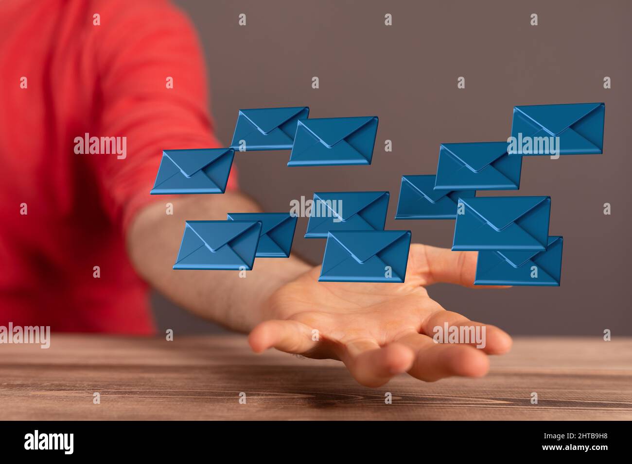 Shallow focus shot of a human hand holding email icons- communication ...