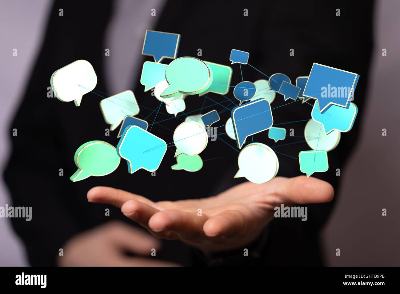 Shallow focus shot of a human hand holding colorful chat bubbles ...