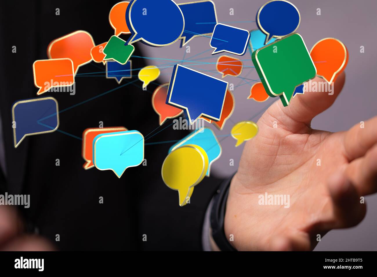 Shallow focus shot of a human hand holding colorful chat bubbles ...