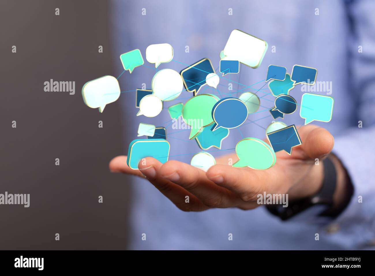 Shallow focus shot of a human hand holding colorful chat bubbles ...