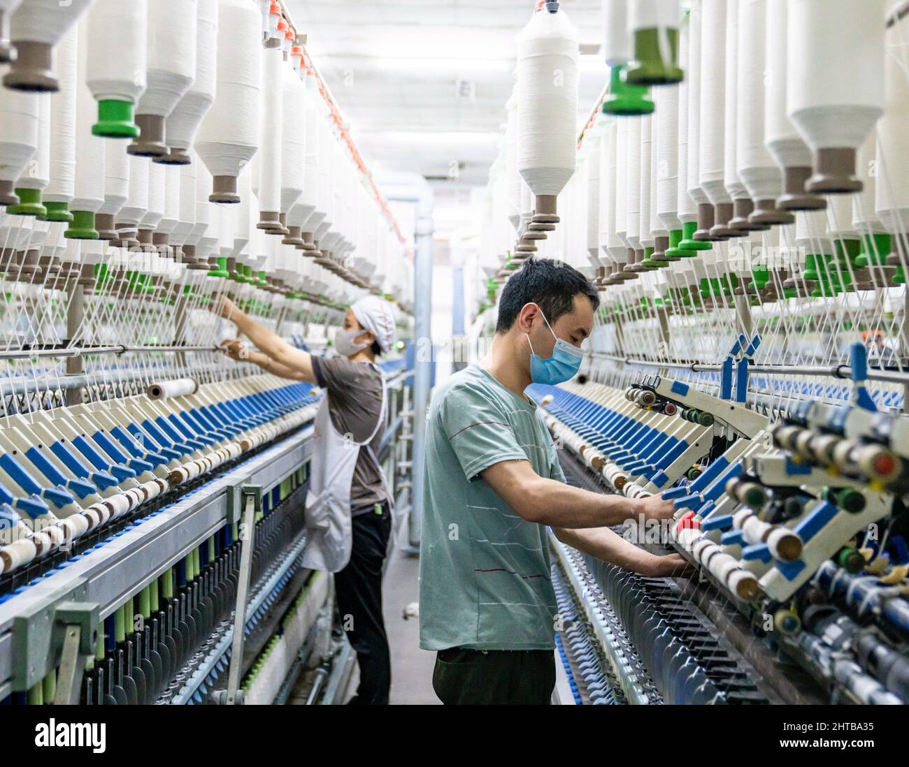 HAIAN, CHINA - FEBRUARY 28, 2022 - A worker works on a production line ...