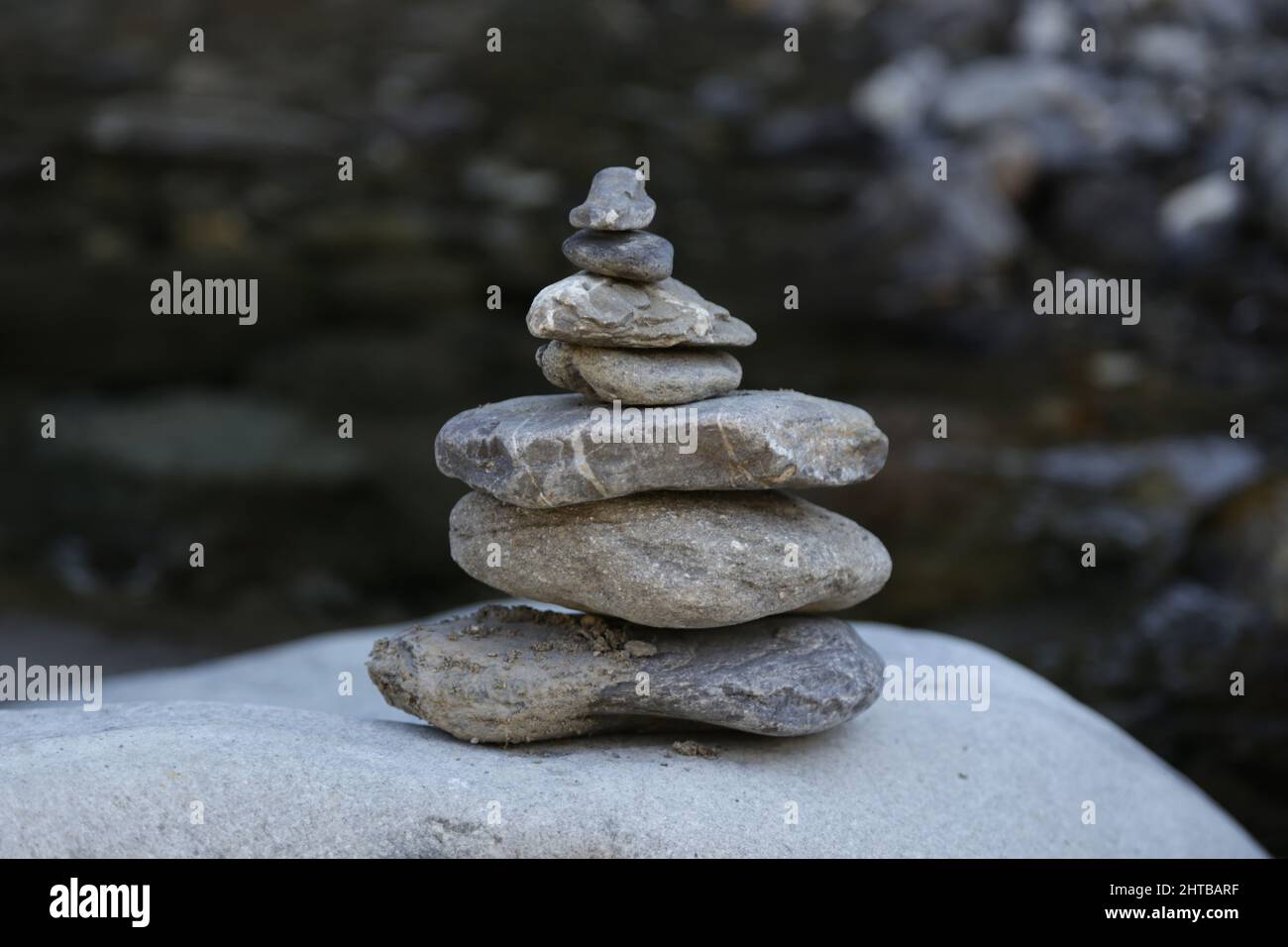 Closeup of stacked stones outside Stock Photo - Alamy