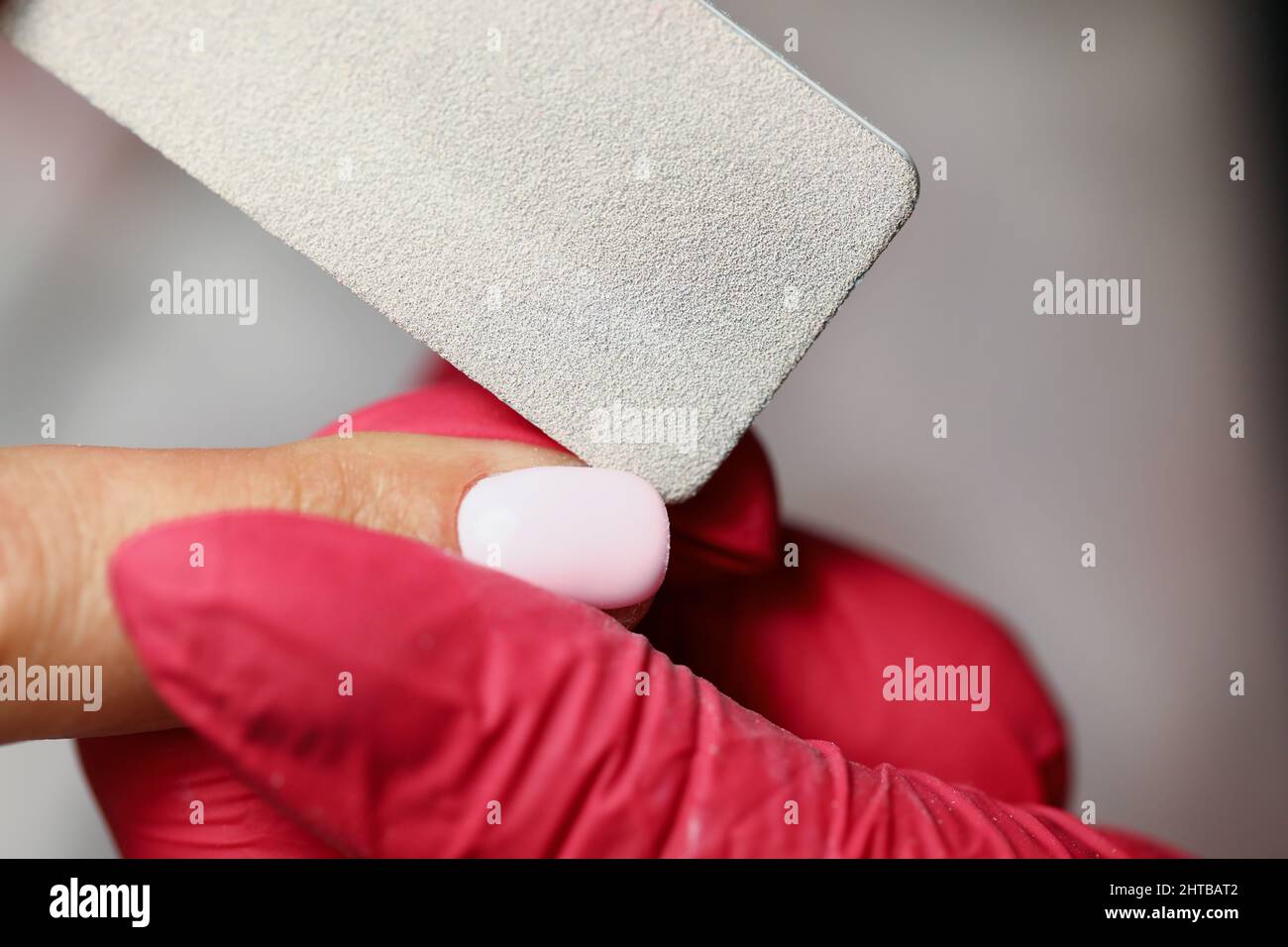 Woman filing her nails hi-res stock photography and images - Alamy