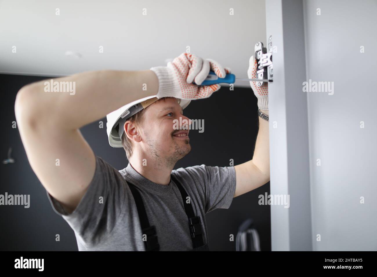 Mature service man installing hi-res stock photography and images - Alamy