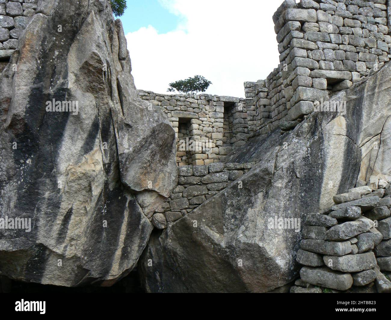 Bright summer day outdoors in Machu Picchu with ancient stone ...