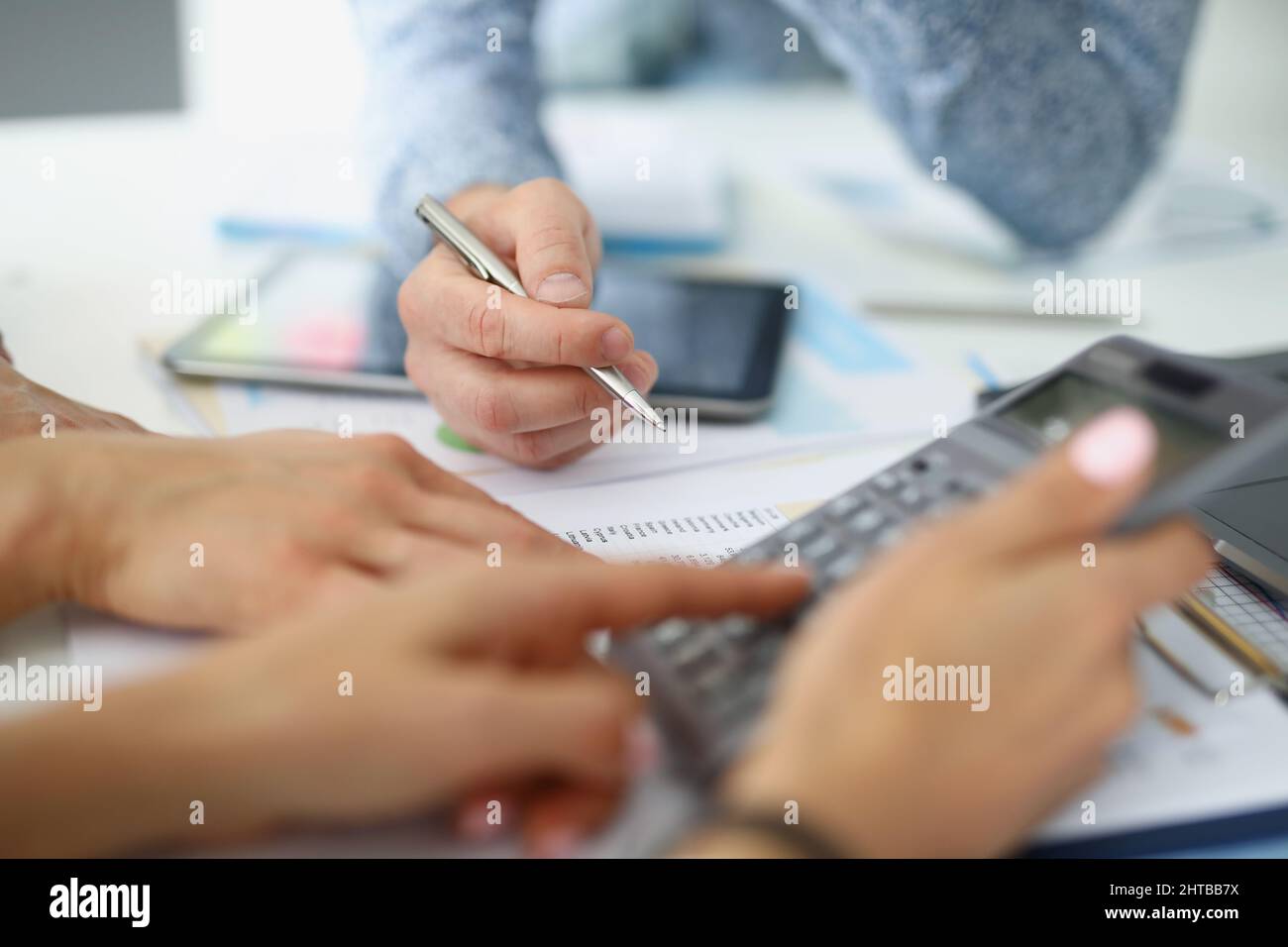 Staff writing financial report Stock Photo - Alamy