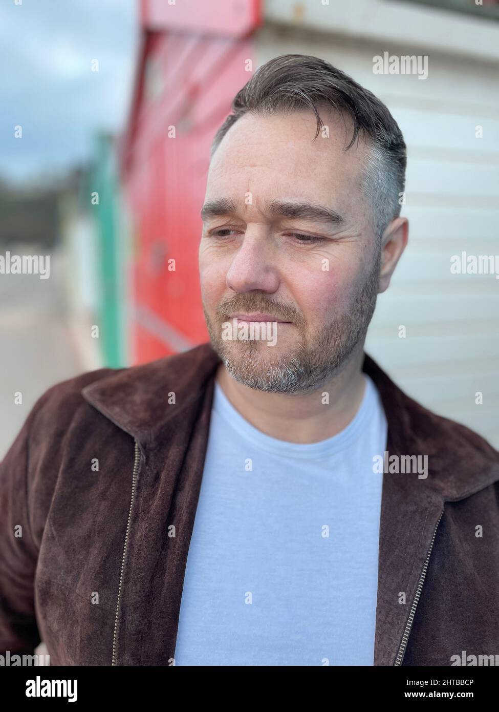 A portrait of a bearded handsome middle aged Caucasian male on the ...
