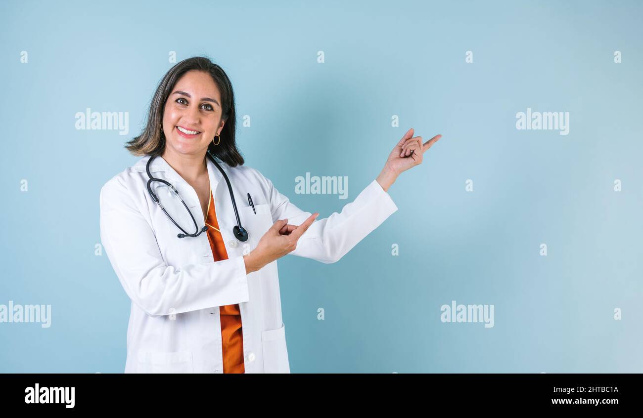latin doctor woman over blue background laughing in Mexico Latin ...