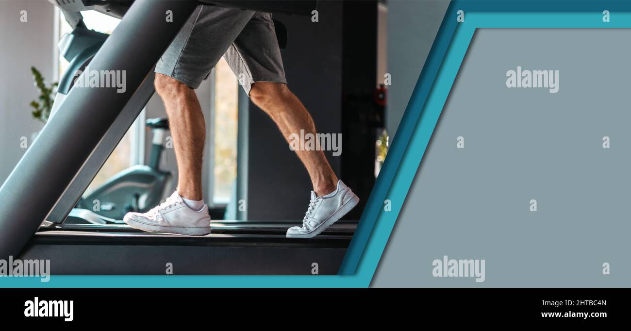Athletic man training on a treadmill. Close up of feet and equipment ...